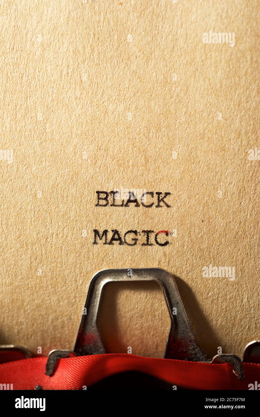 Black magic text written with a typewriter Stock Photo - Alamy