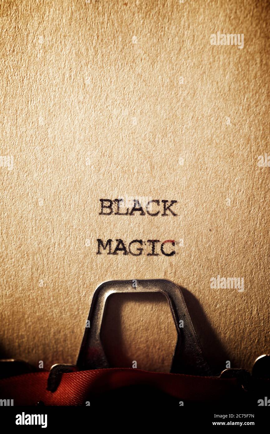 Black magic text written with a typewriter Stock Photo - Alamy