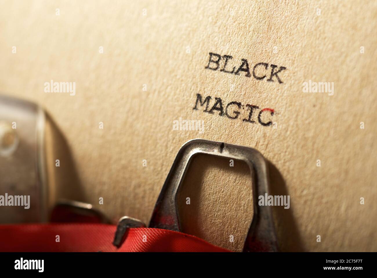 Black magic text written with a typewriter Stock Photo - Alamy