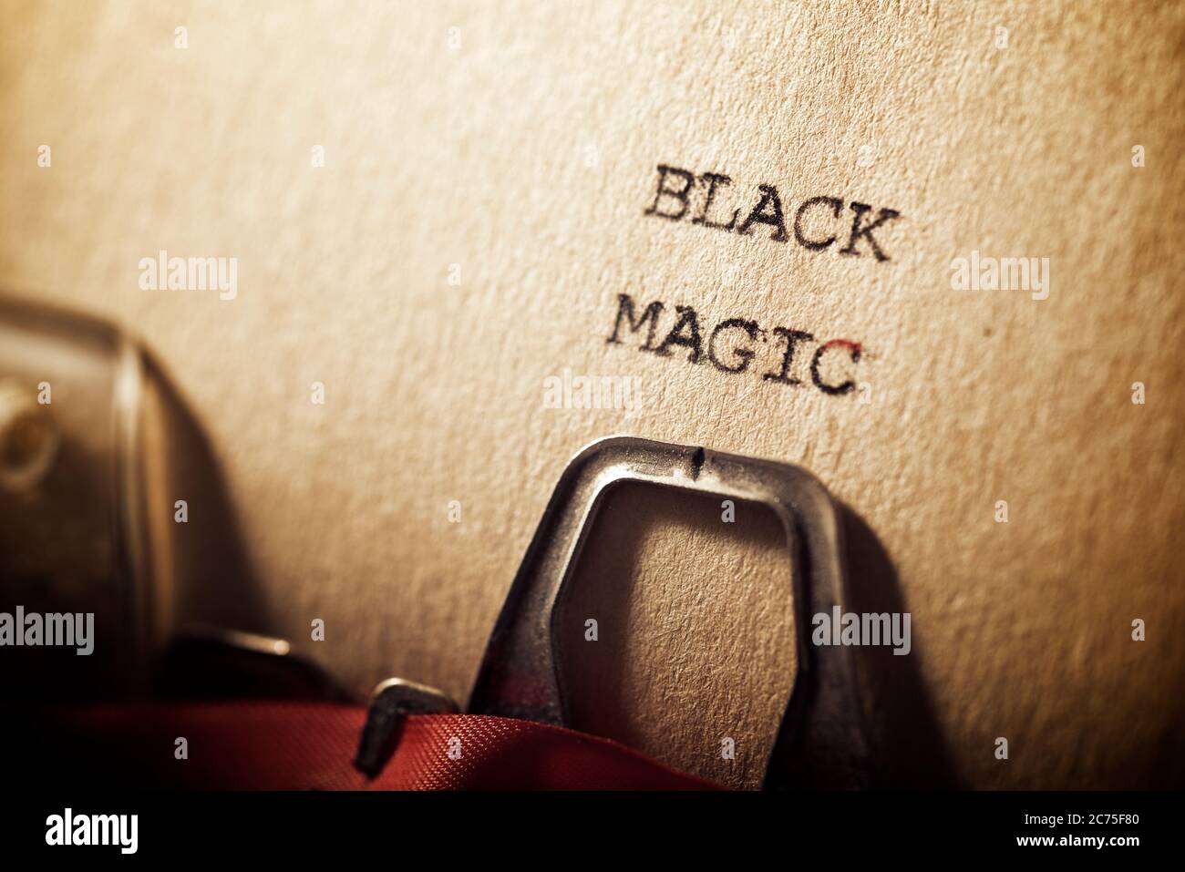 Black magic text written with a typewriter Stock Photo - Alamy
