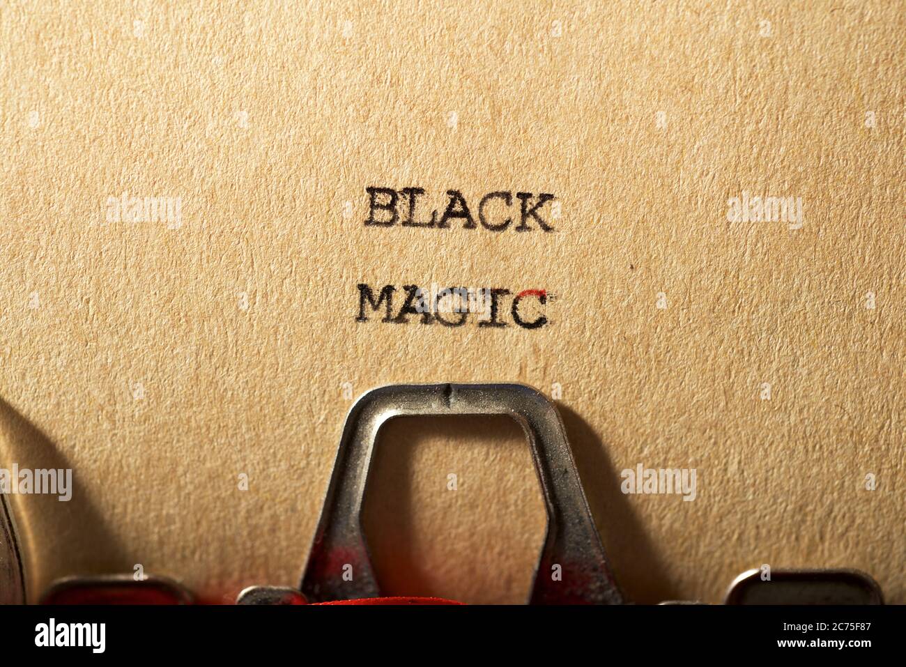 Black magic text written with a typewriter Stock Photo - Alamy