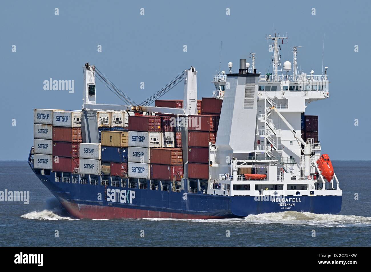 Containervessel Helgafell outbound from the port of Cuxhaven Stock ...