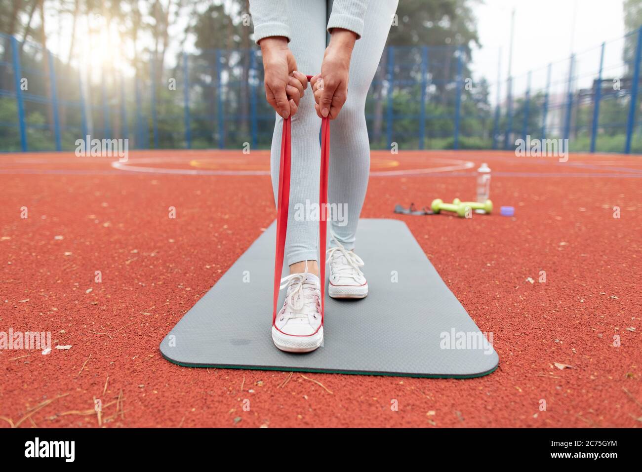 Concept of sports training outdoors. Cropped shot of female legs and ...