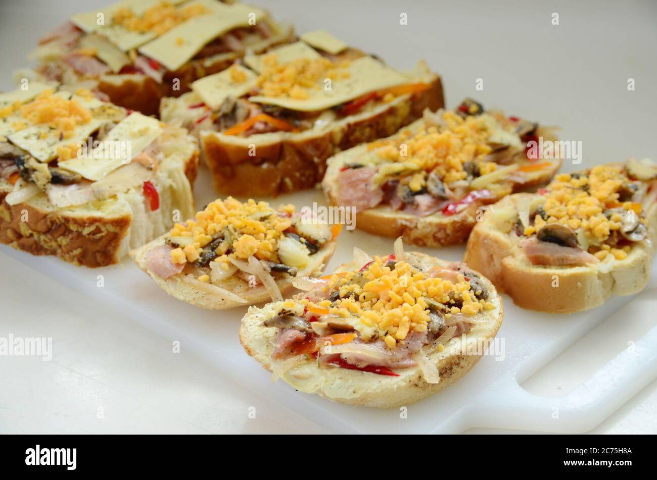 Toast with cheese, mayo and tomatoes sauce Stock Photo - Alamy