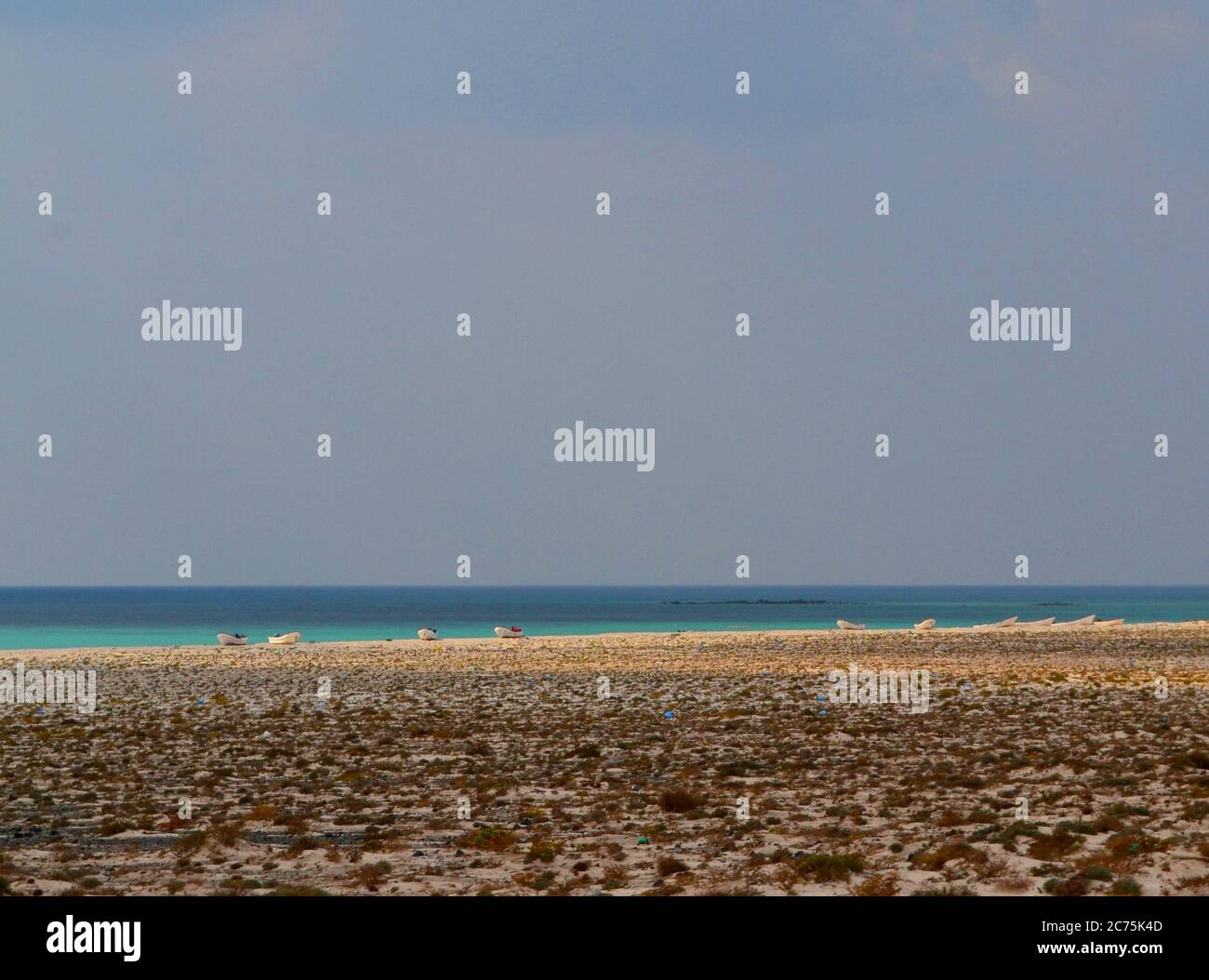 Boats on the beach on Masirah island, Oman Stock Photo - Alamy