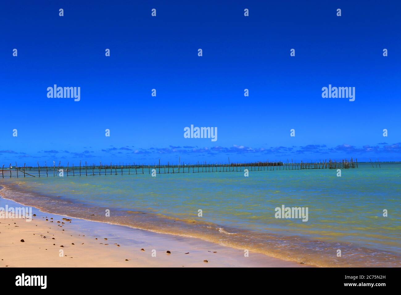 Traditional wooden fishing structures in the beautiful coastal village ...