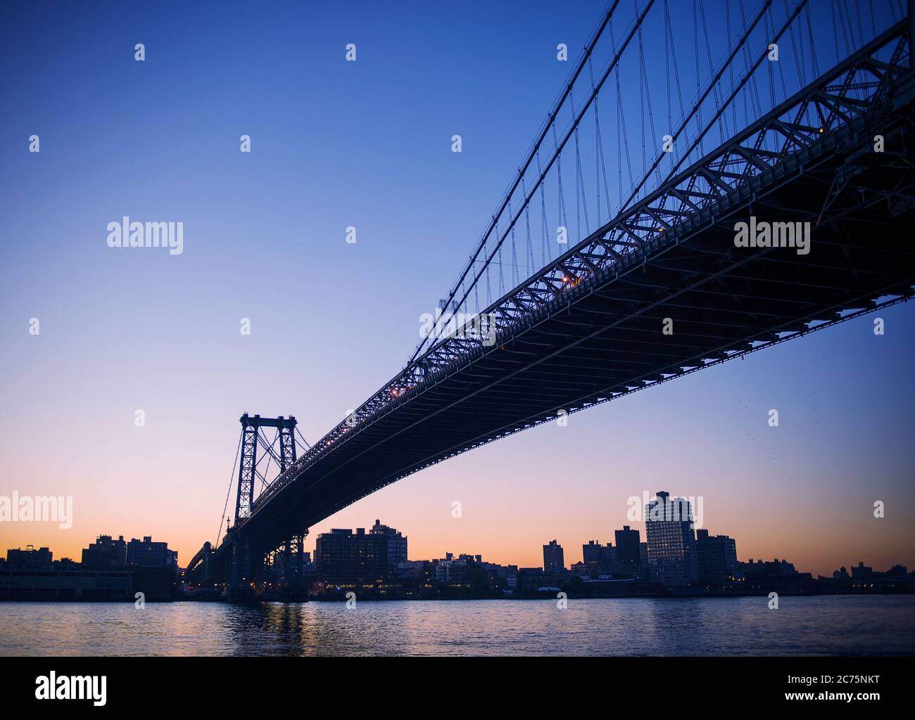Williamsburg bridge and the east river at sunrise, Manhattan, New York ...