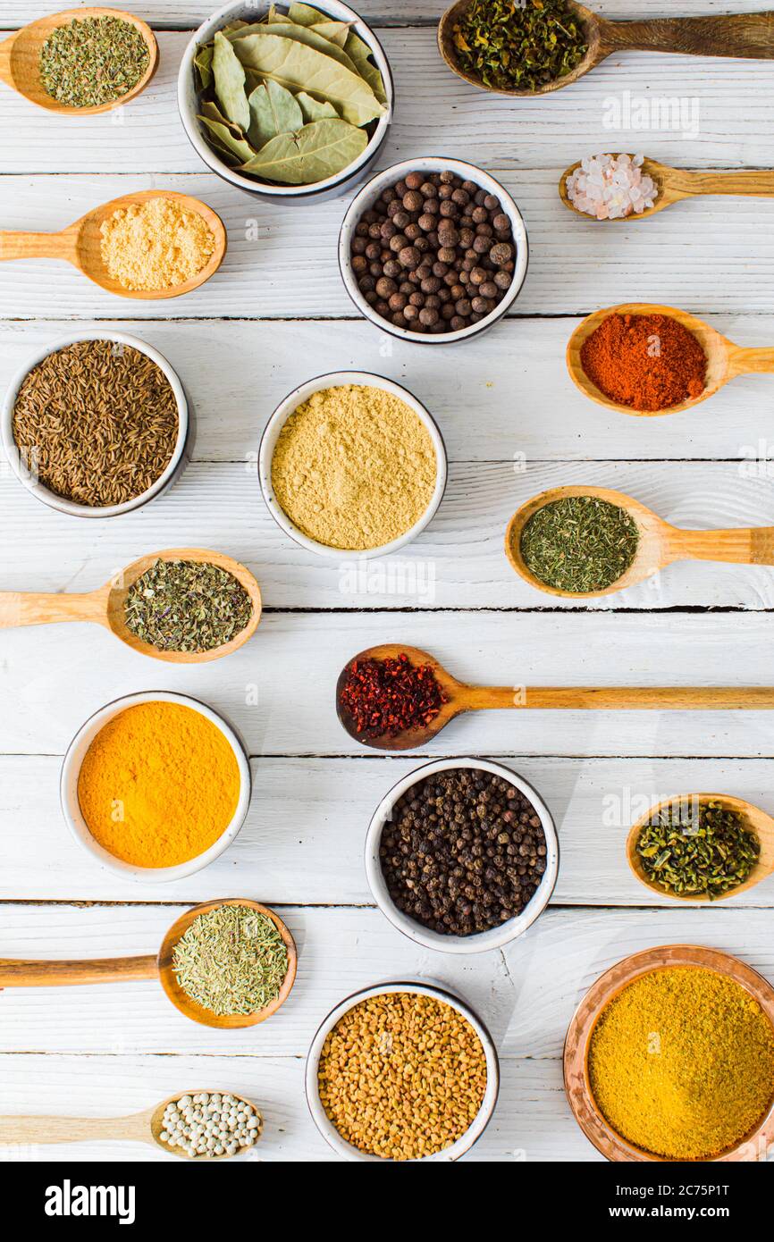 Collection of spicy condiments in spoons and bowls Stock Photo - Alamy