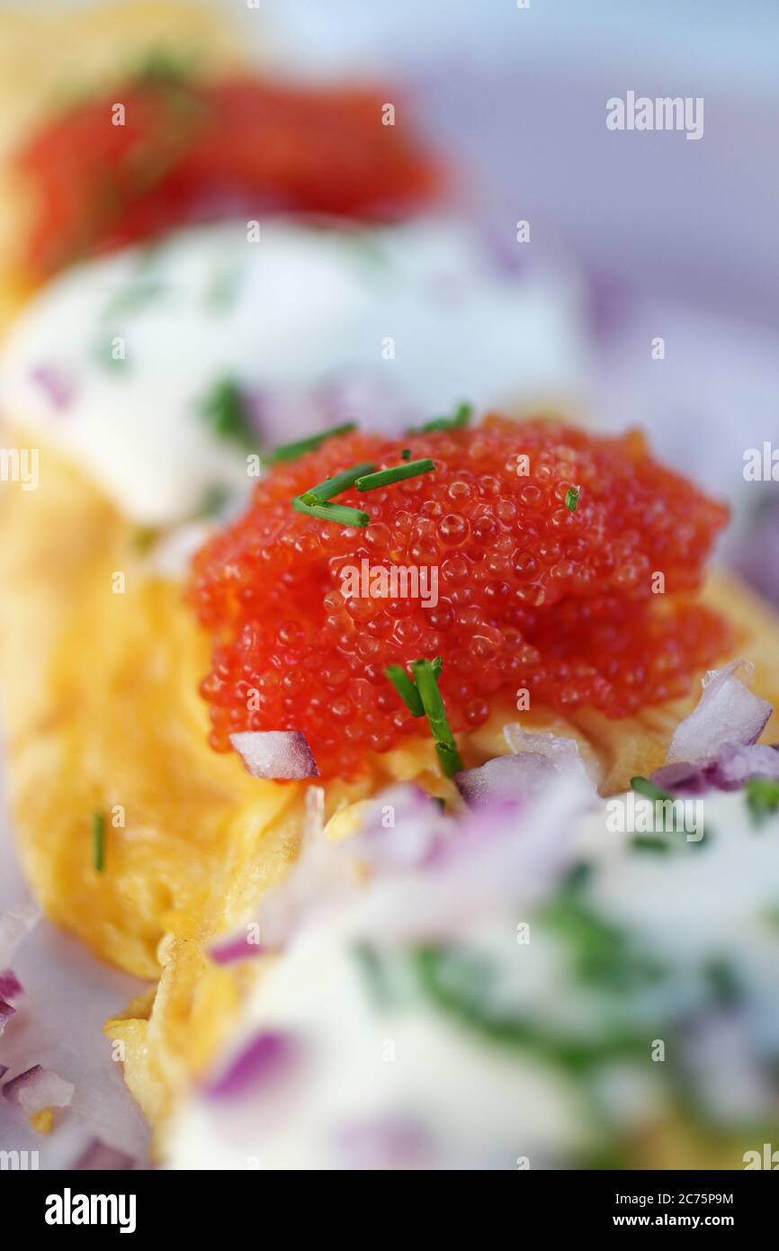 An omelette with sour cream, rum, red onion and chives on. Photo Jeppe ...