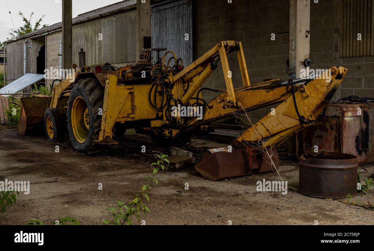 Overgrown old farm equipment hi-res stock photography and images - Alamy