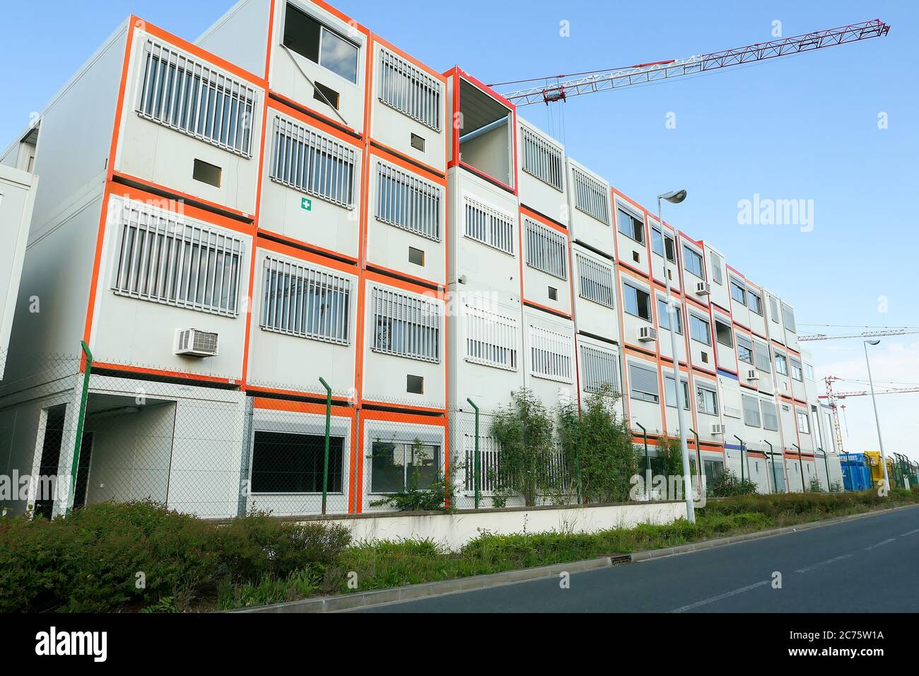 Prefabricated modular offices. Stacking of boxes for construction site ...