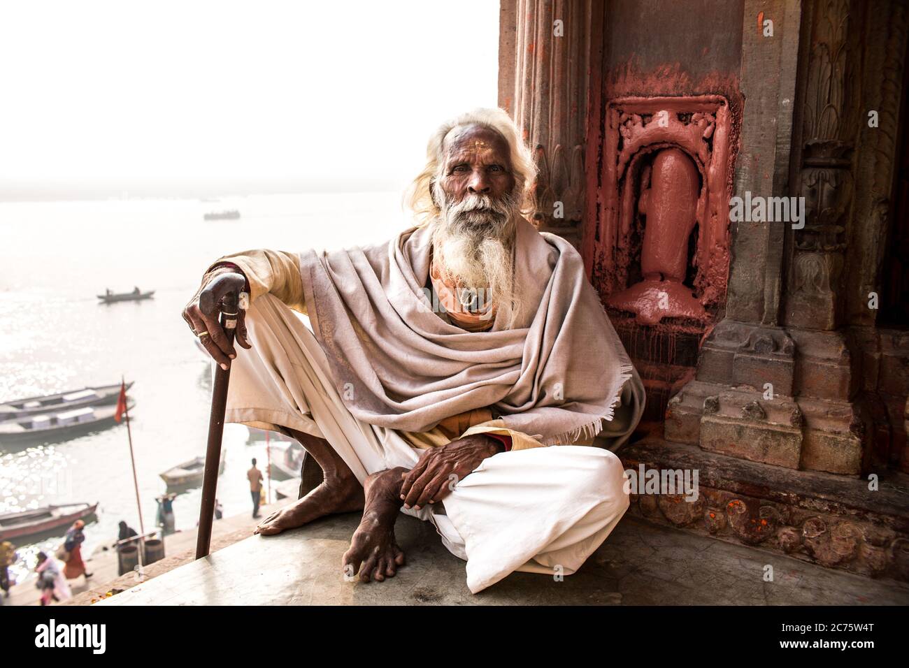 Sadhu is sitting next to the Ganges River in Varanasi, India Stock ...