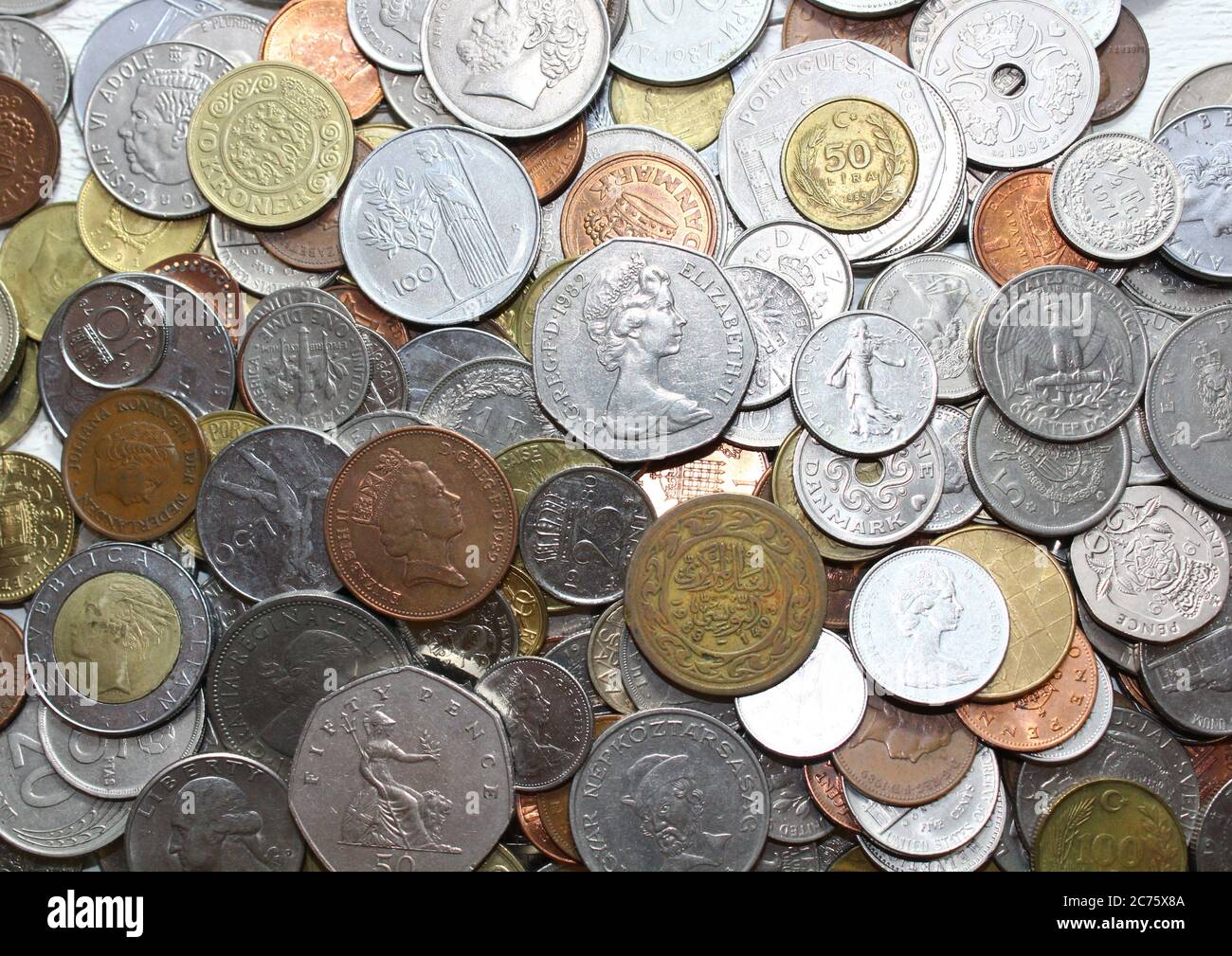 The picture shows background with old coins from all over the world ...