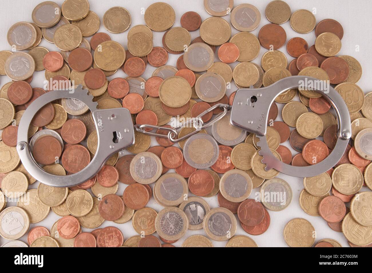 Picture of a Business Money Concept Idea Conis and Handcuffs Stock ...