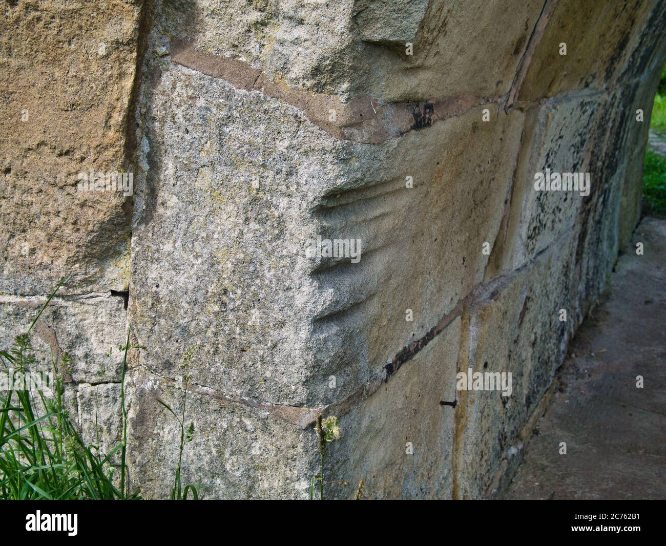 Grooves cut in the side of a bridge over the Leeds to Liverpool Canal ...
