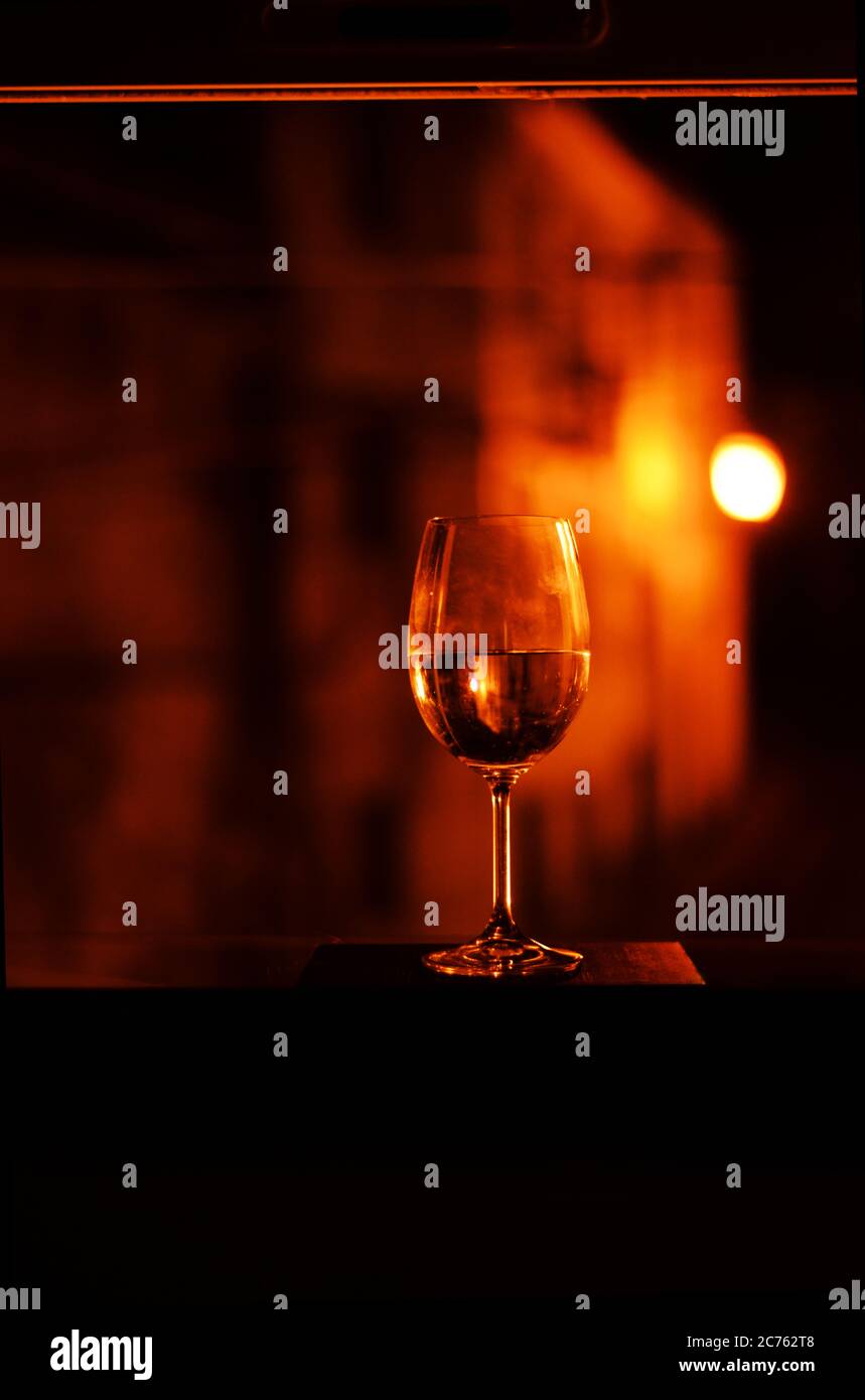 Wine glass on a window sill Stock Photo - Alamy