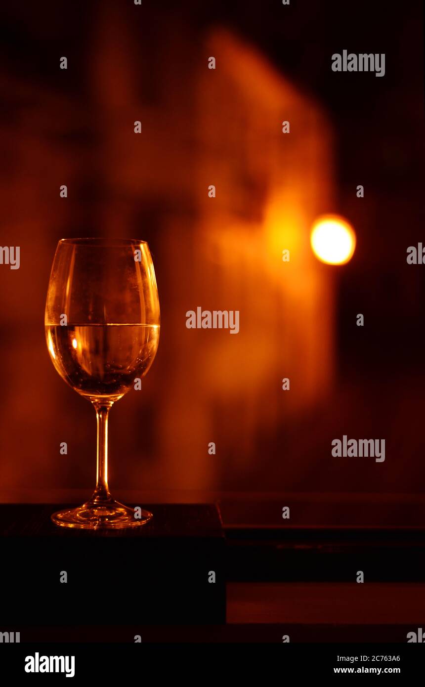 Wine glass on a window sill Stock Photo - Alamy
