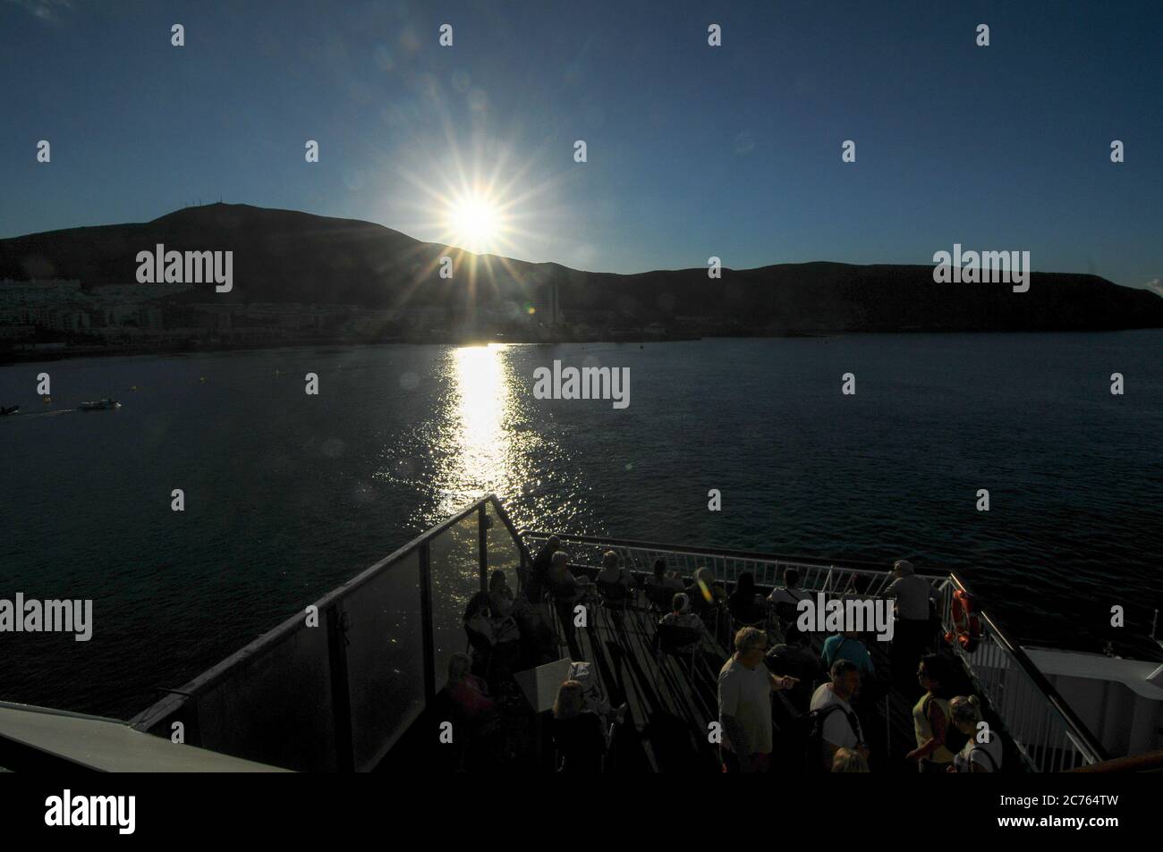 Dramatic Sunset Rays Behind Silhouette of a Mountain Stock Photo - Alamy