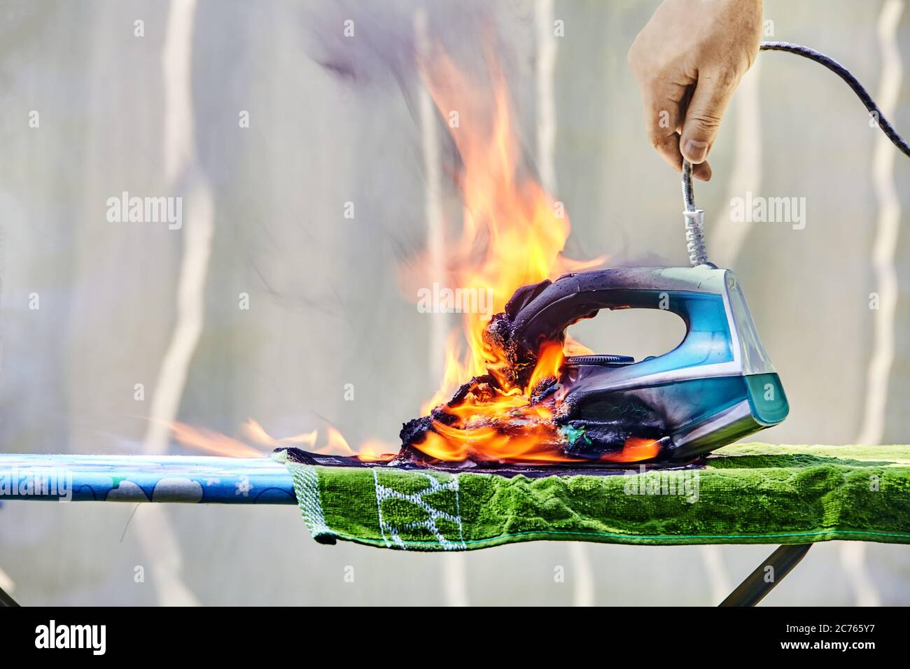 Burned iron for ironing clothes, which was connected to the power of ...