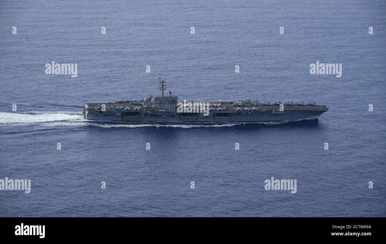 The U.S. Navy Nimitz-class aircraft carrier USS Theodore Roosevelt transits during dual carrier ...