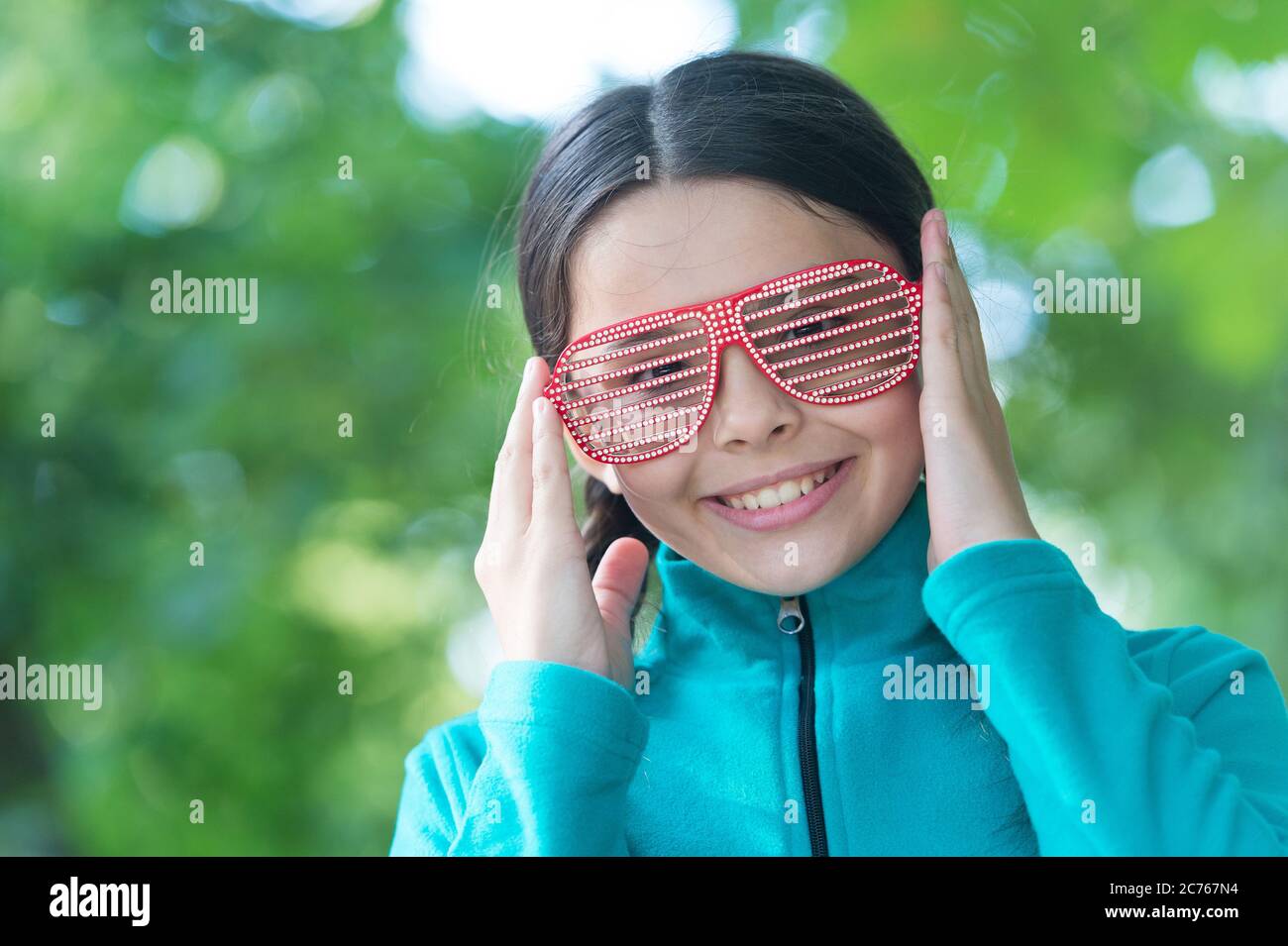 My favorite fashion accessory. Happy girl wear fancy glasses. Little ...