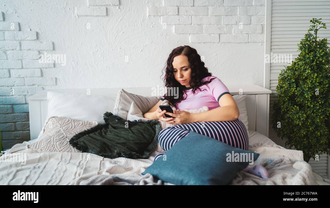 Woman in pajamas learning hi-res stock photography and images - Alamy
