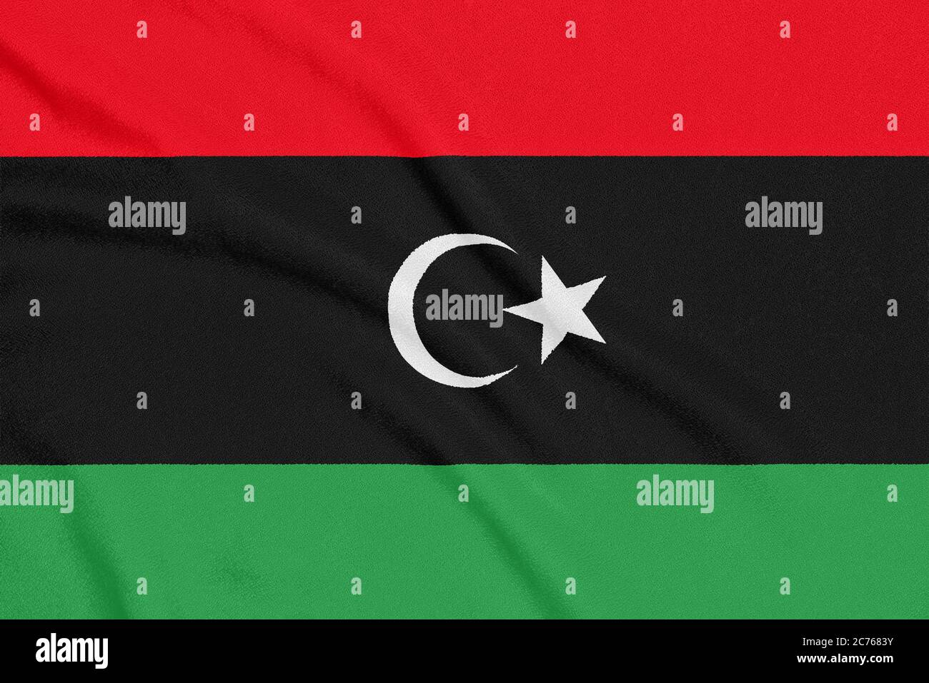 Flag of Libya on textured fabric. Patriotic symbol Stock Photo - Alamy