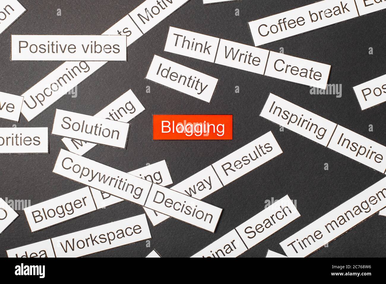 Cut paper inscription blogging on a red background, surrounded by other ...