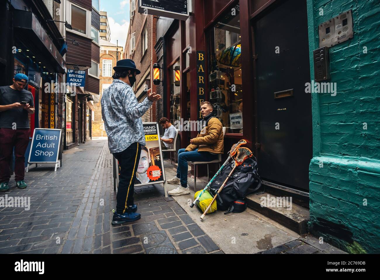 Queue in barber shop people waiting haircut hi-res stock photography ...