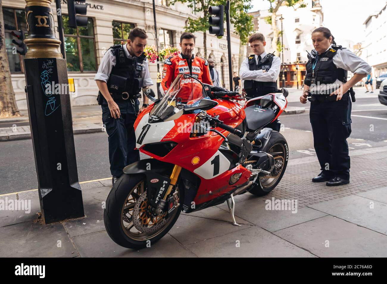 London / UK - 07/11/2020: Police officers arresting motorbike driver in ...