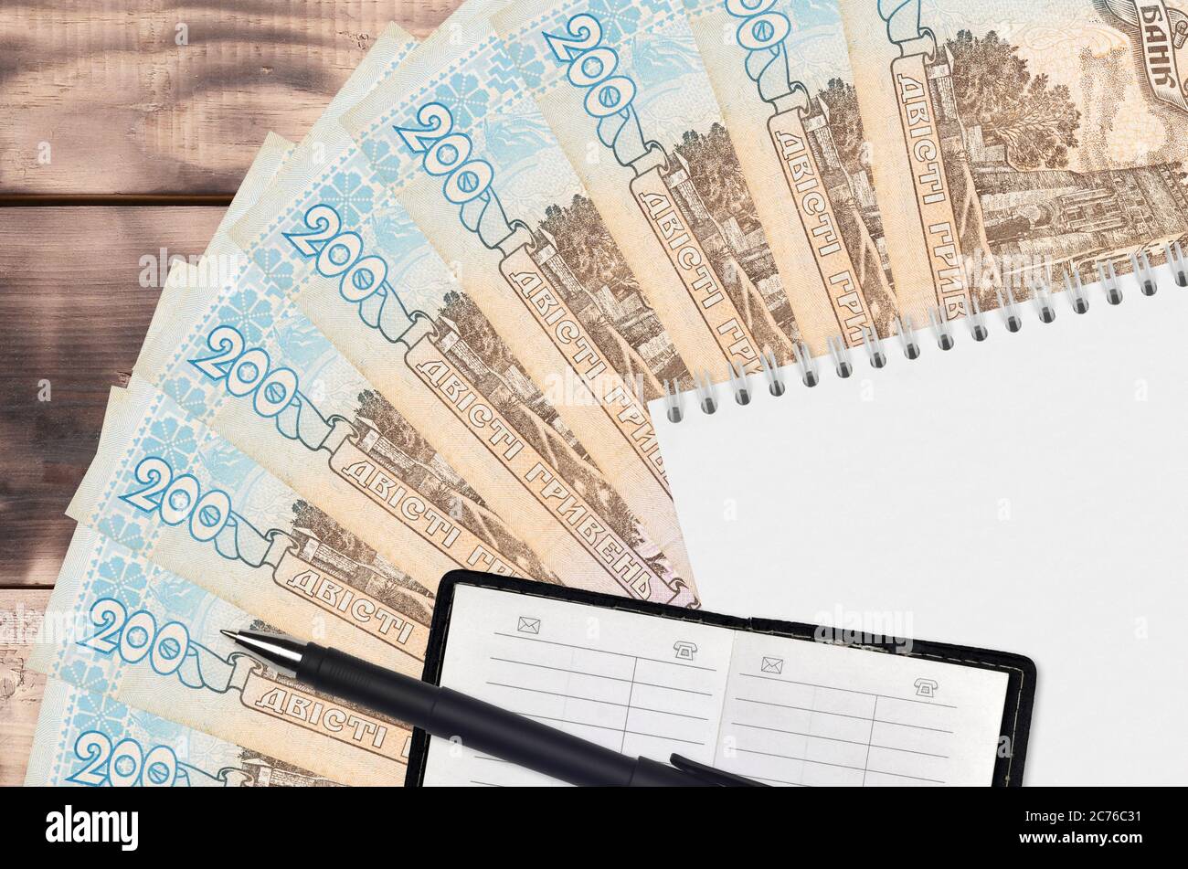 200 Ukrainian hryvnias bills fan and notepad with contact book and ...