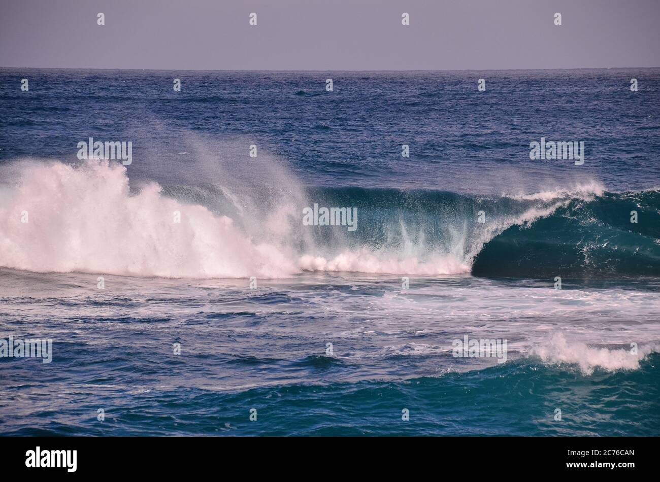 Big Blue Wave Breaks in the Atlantic Ocean Stock Photo - Alamy