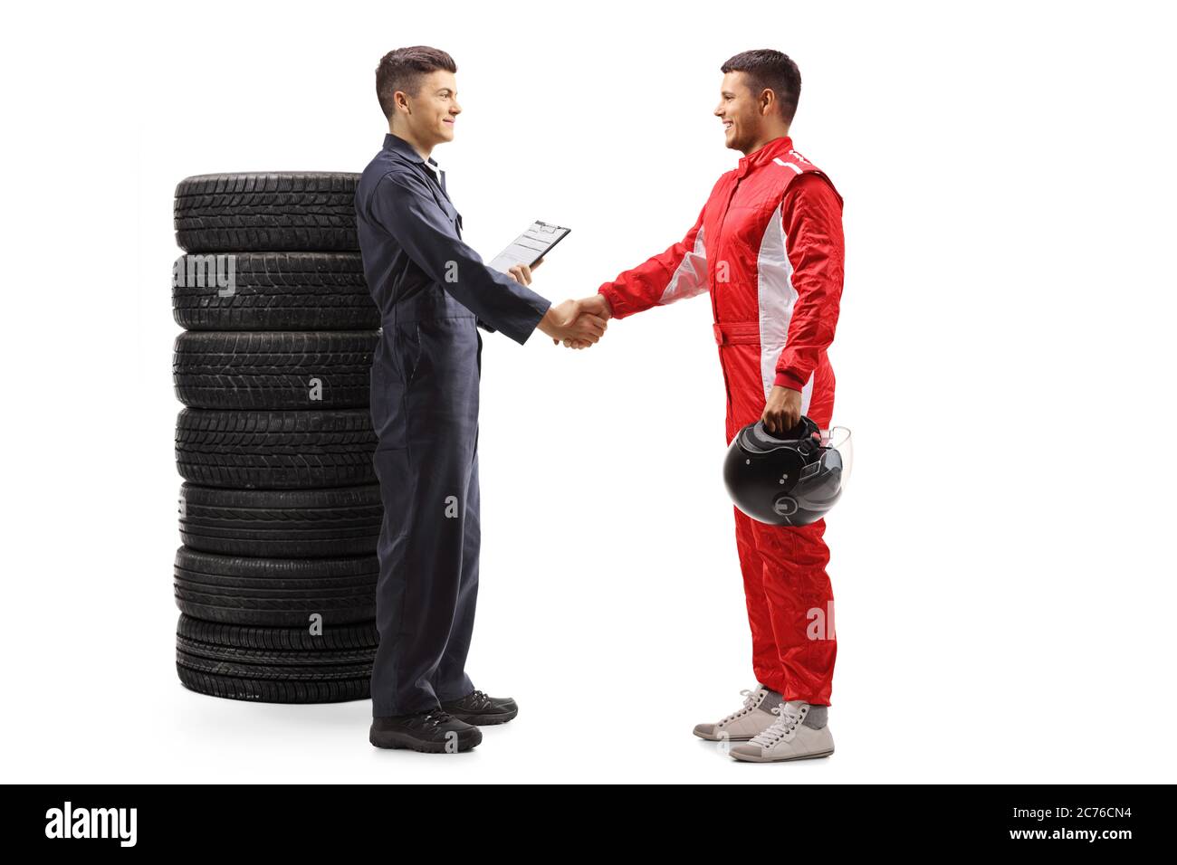 Full length profile shot of an auto mechanic shaking hands with a ...