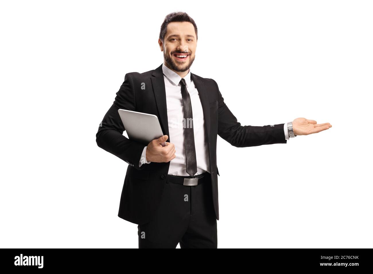 Smiling businessman holding a tablet and gesturing welcome with hand ...