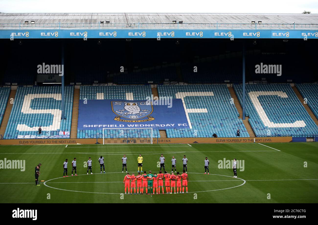 Sheffield Wednesday and Huddersfield Town players observe a minute's ...