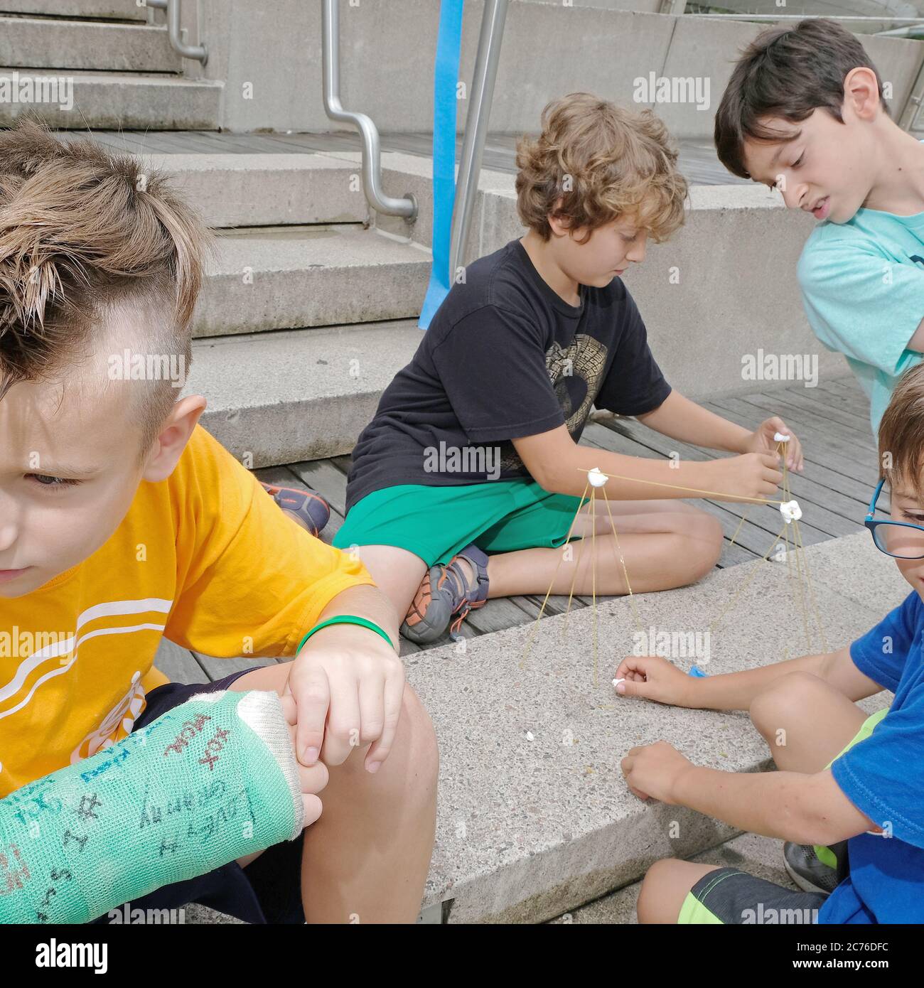 Day Camp, Brooklyn, New York City. Kids build towers out of spaghetti ...