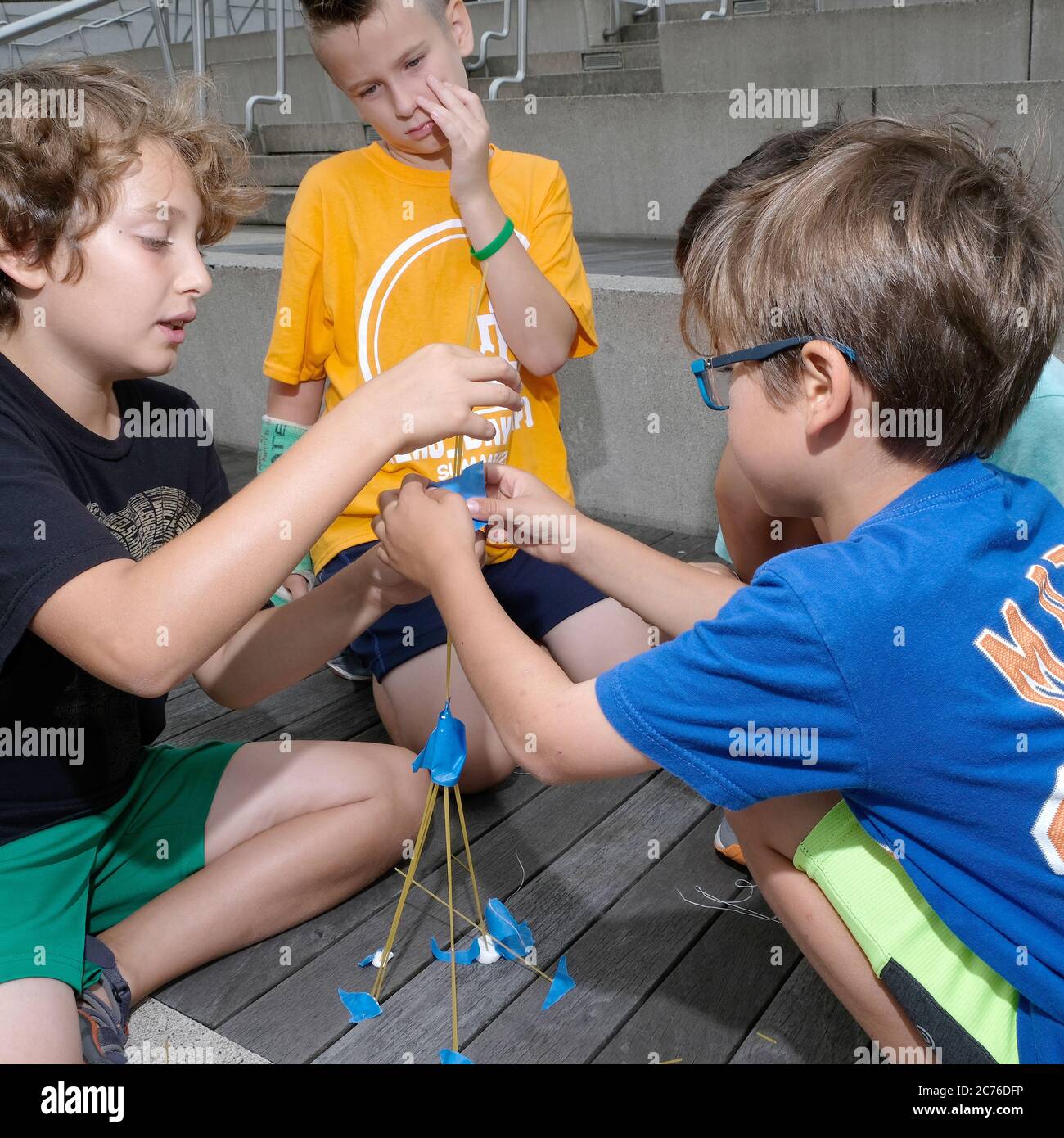 Day Camp, Brooklyn, New York City. Kids build towers out of spaghetti ...