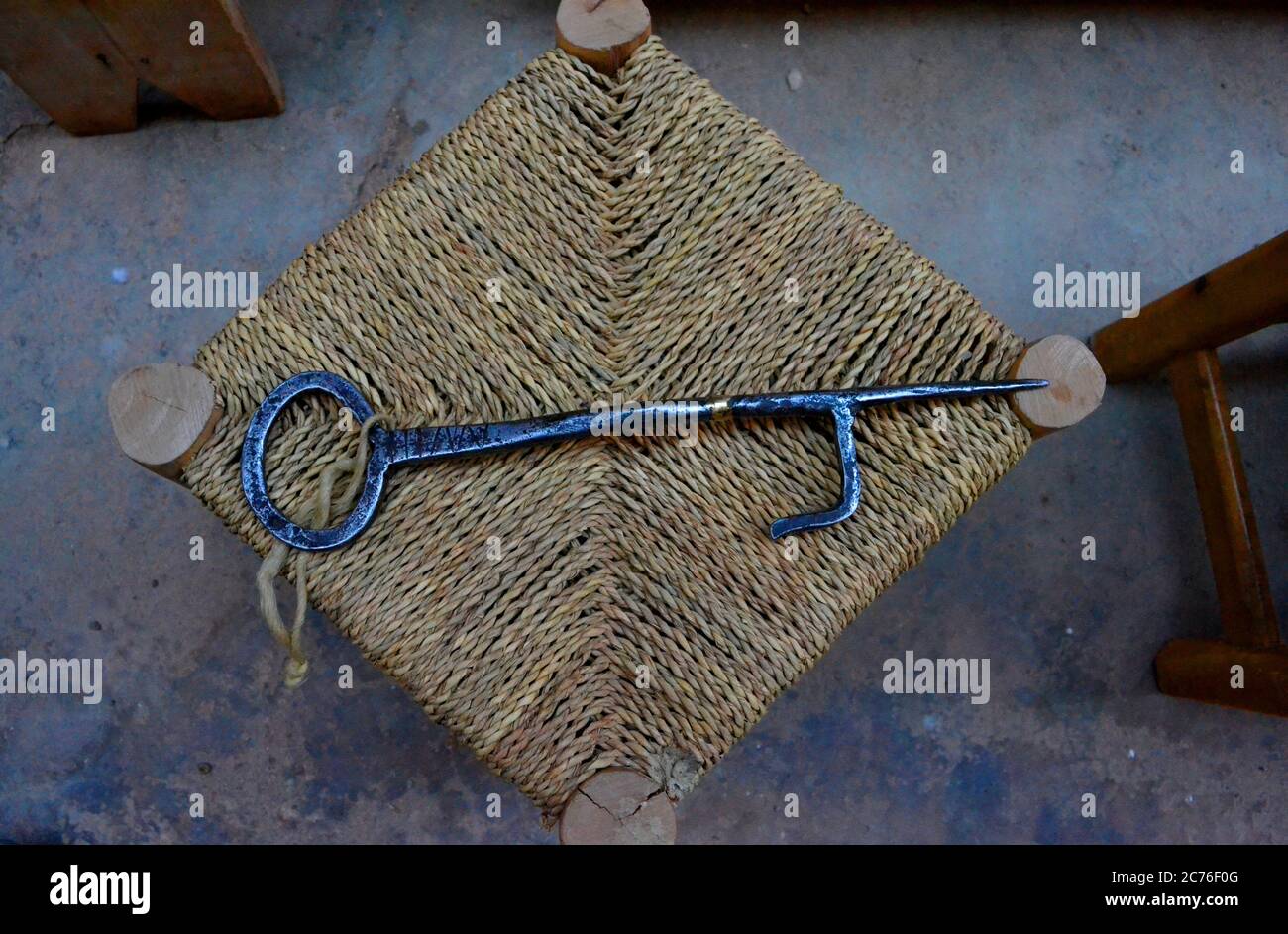 Huge traditional key on a chair Stock Photo - Alamy