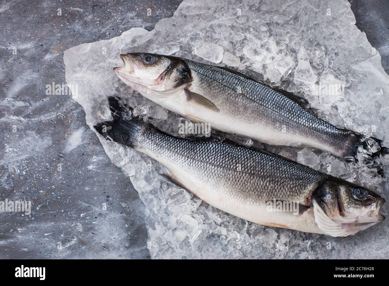Raw fresh sea bream fish, top view, gray background Stock Photo - Alamy