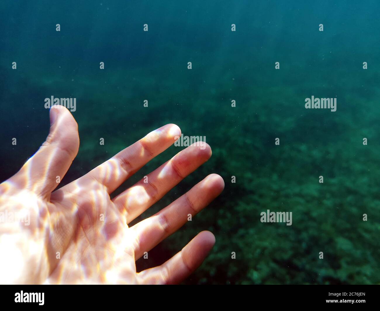 Arm and hand underwater hi-res stock photography and images - Alamy