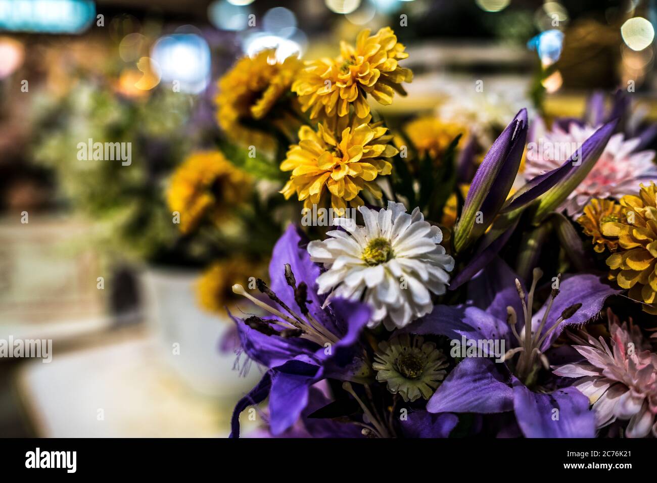 Decoration of various artificial flowers. Close-up of installation of ...