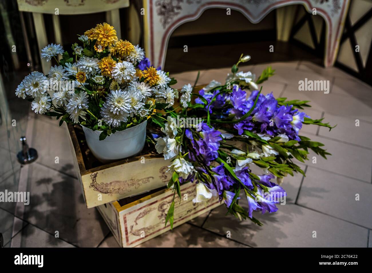 Decoration of various artificial flowers. Close-up of installation of ...