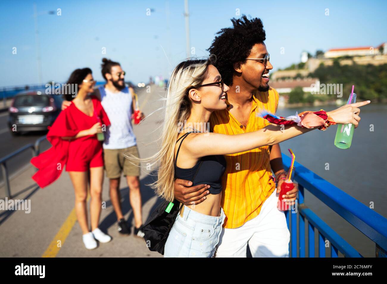 Group of friends having fun and hanging out outdoors Stock Photo - Alamy