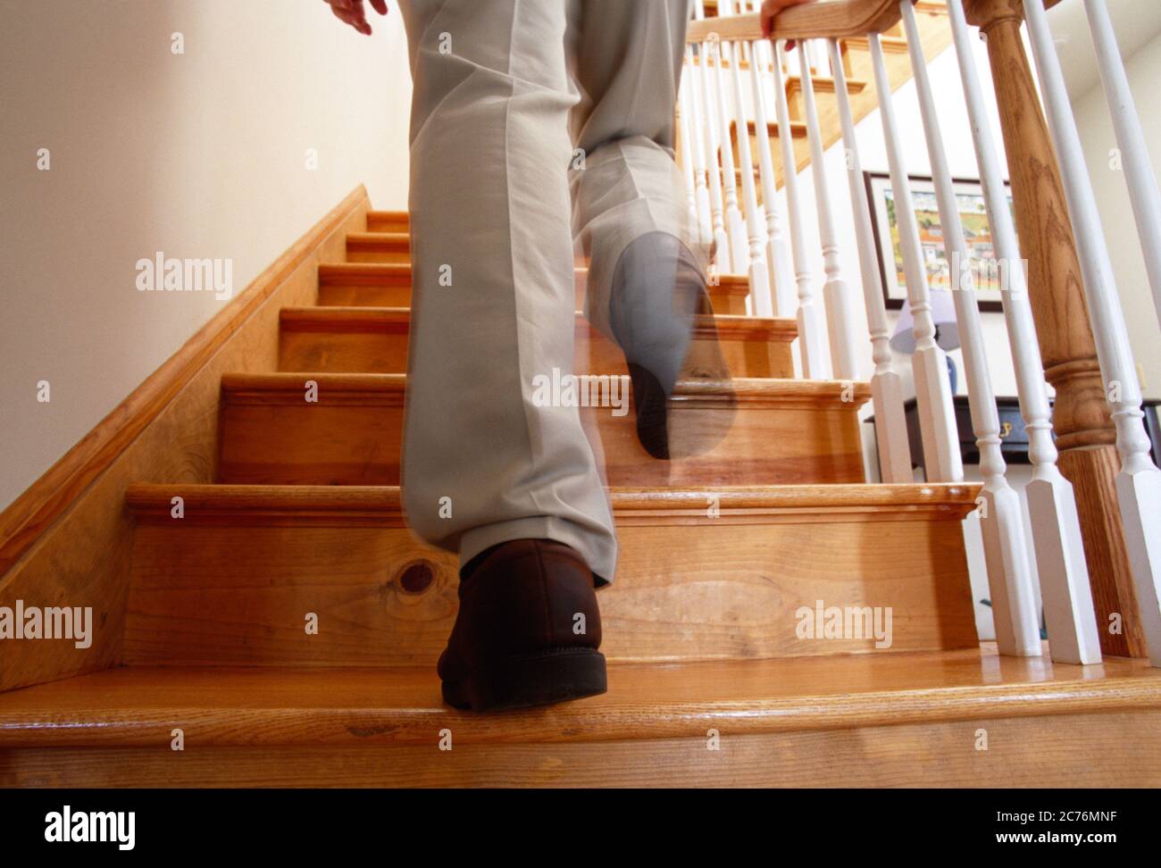 Man Walking Up Residential Flight of Stairs Stock Photo - Alamy