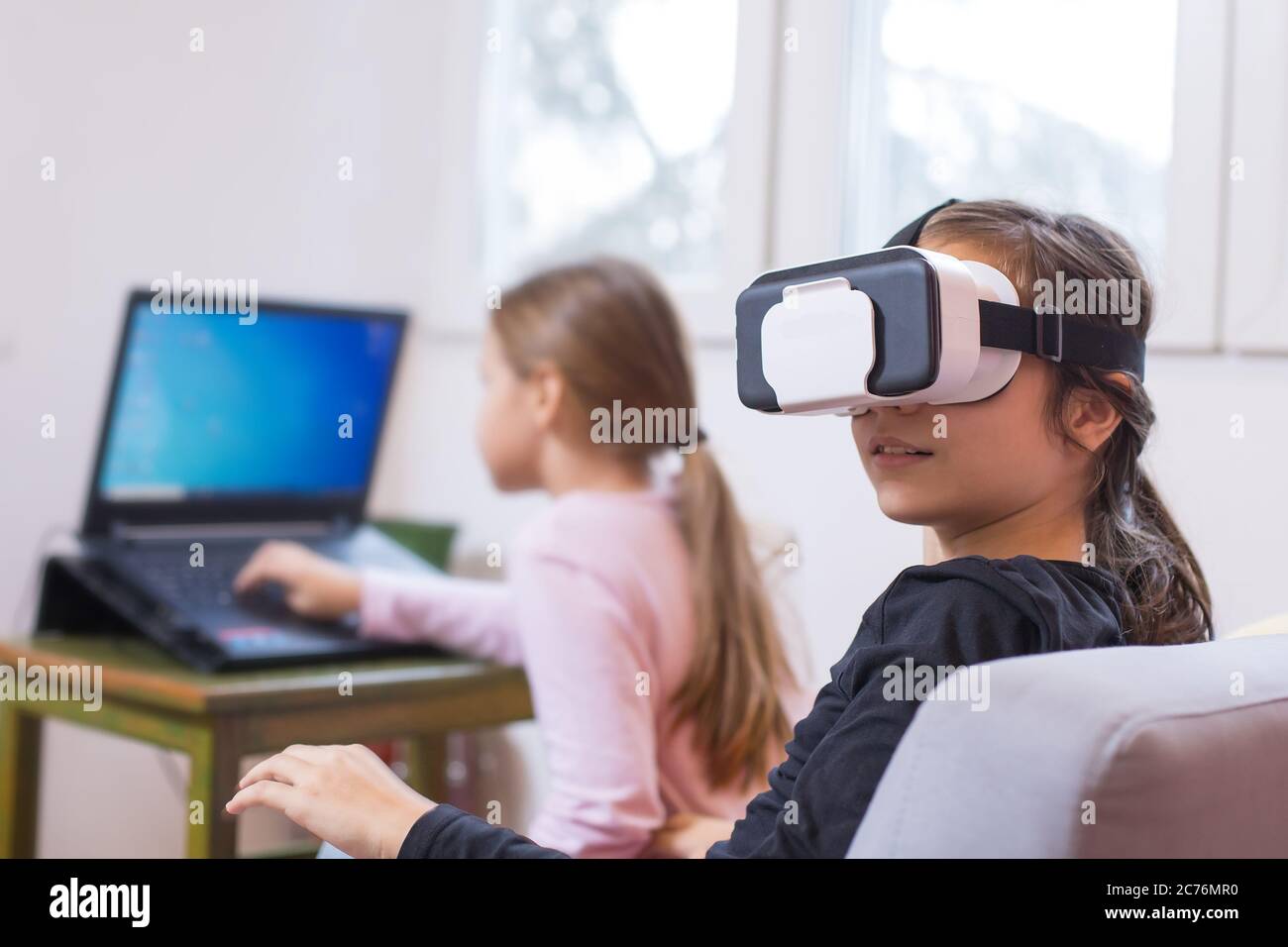 Using laptop and vr goggles hi-res stock photography and images - Alamy