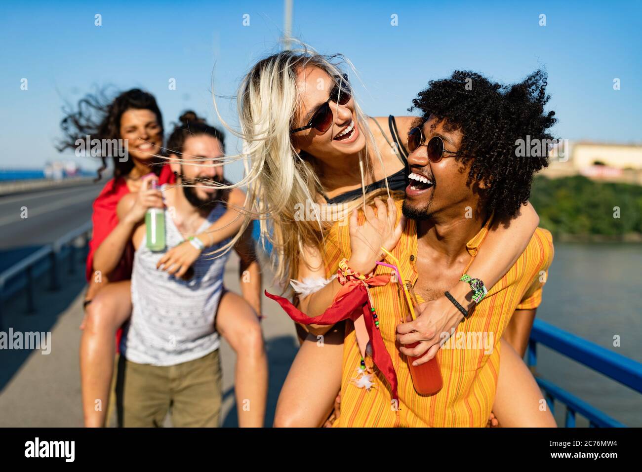 Group of happy friends people having fun together outdoors Stock Photo - Alamy
