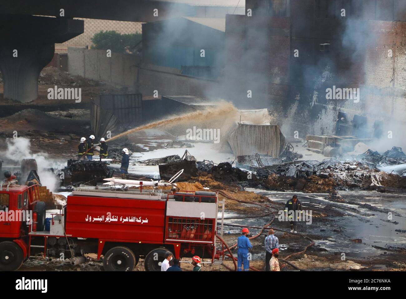 Cairo, Egypt. 14th July, 2020. Firefighters work at the site of a crude ...