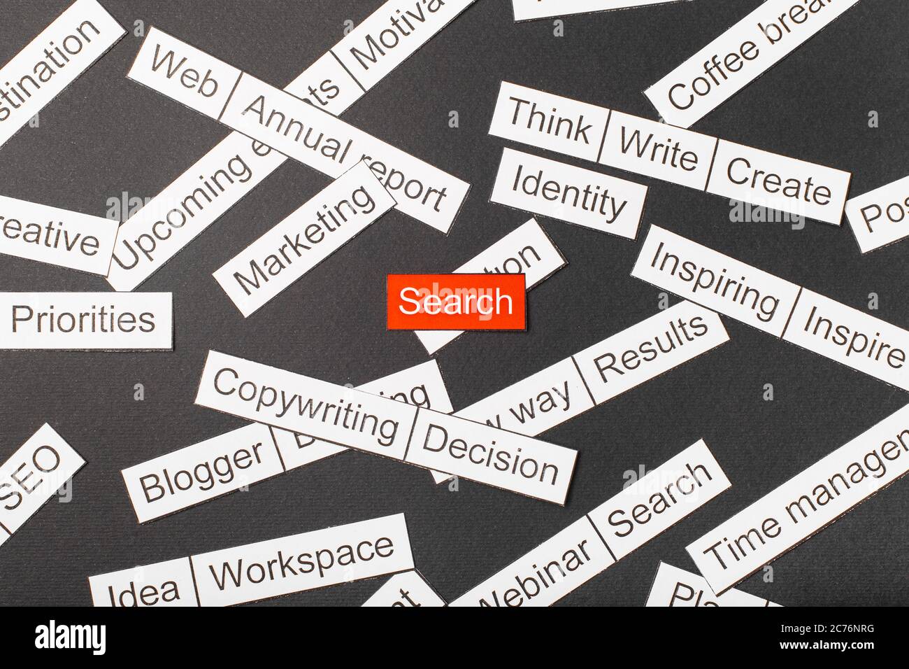 Cut paper inscription search on a red background, surrounded by other ...