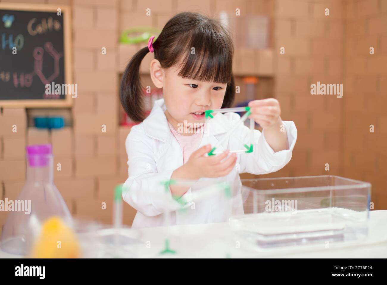 toddler girl play science experiments for homeschooling Stock Photo - Alamy