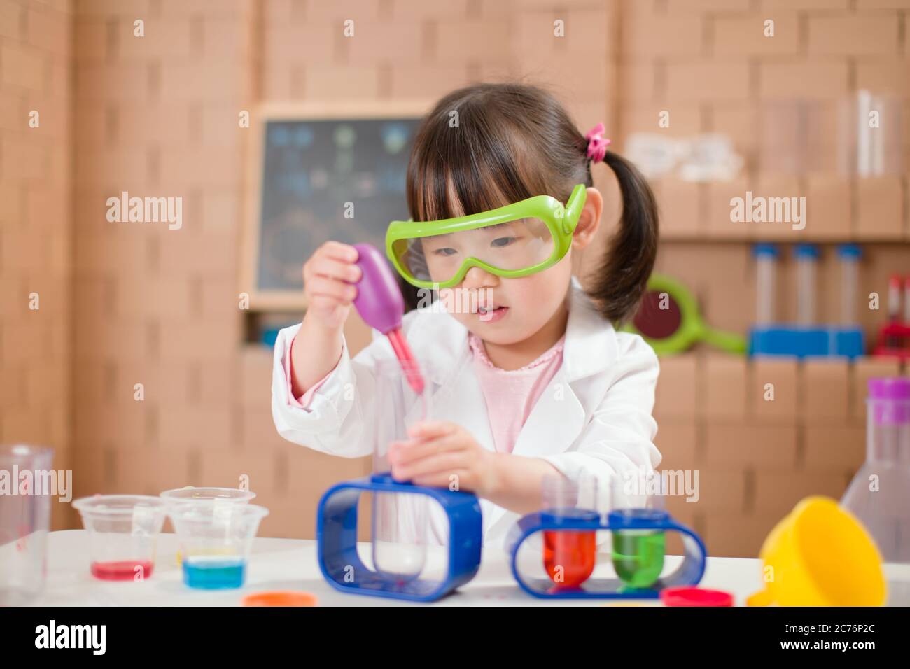 toddler girl play science experiments for homeschooling Stock Photo - Alamy